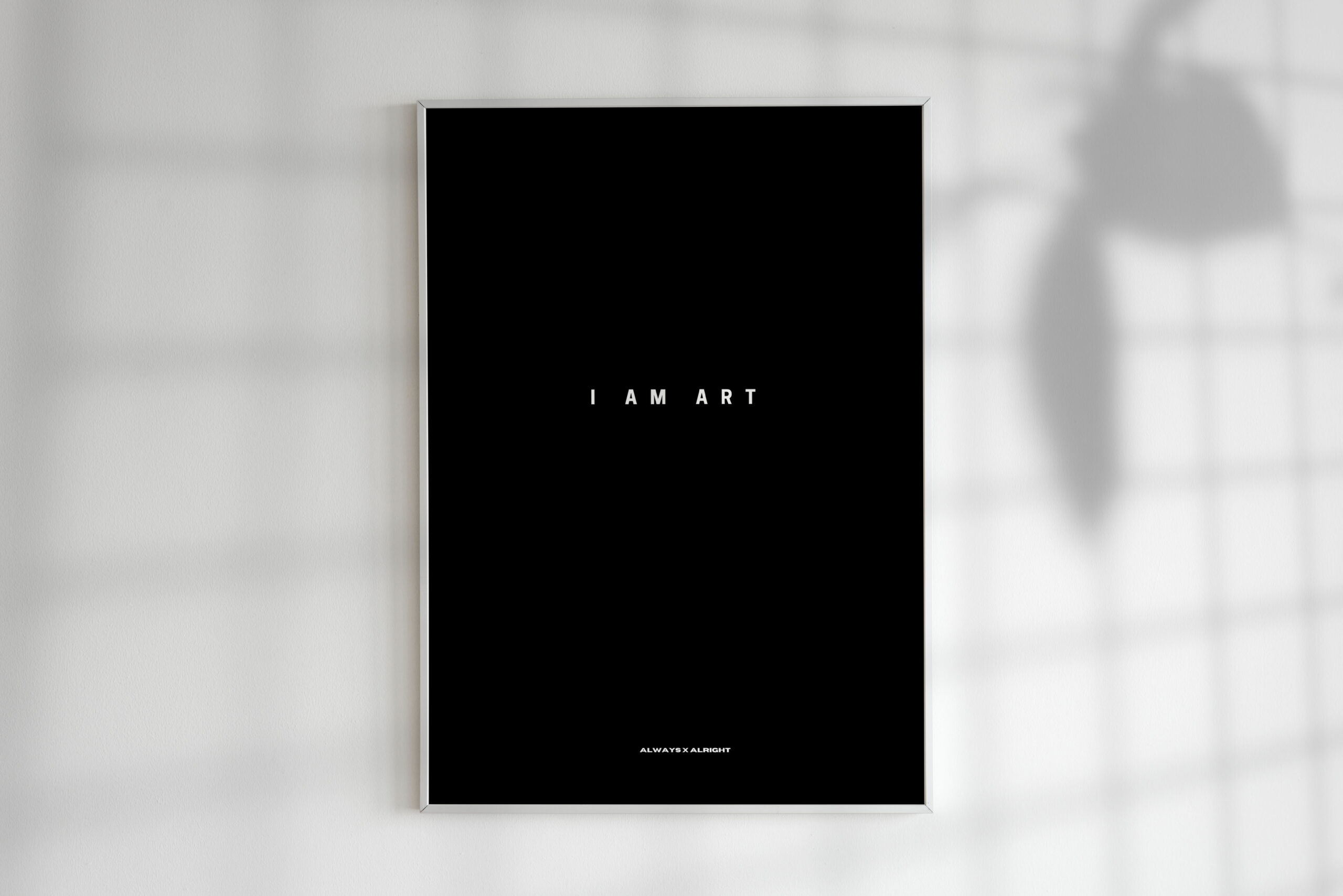 Blank frame on a wall with plant shadow – ETTA ARLENE